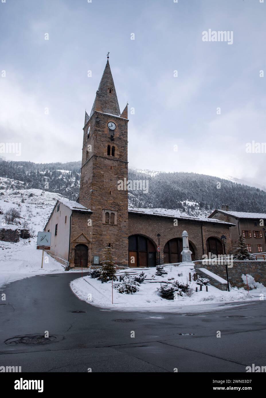 A bell tower and the monument to the fallen soldiers of the WWI in ...