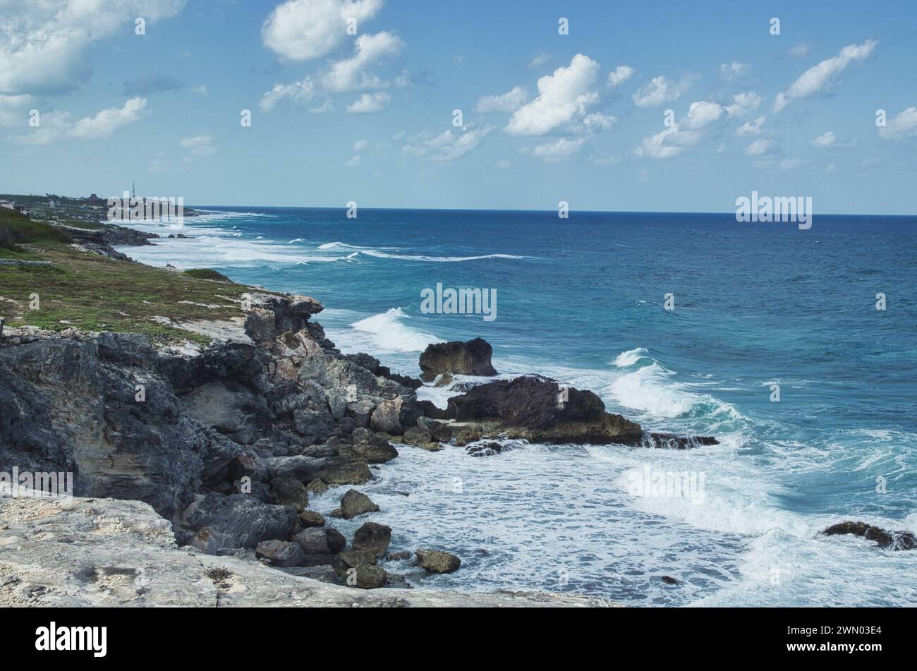 A dramatic view of strong waves and rough seawater splashing against ...