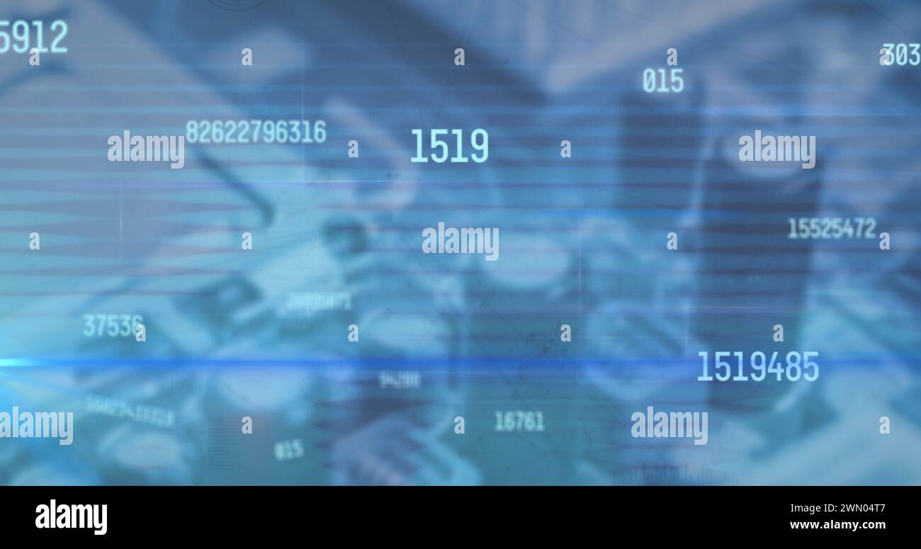 Image of numbers changing and lens flare over defocused motherboard ...