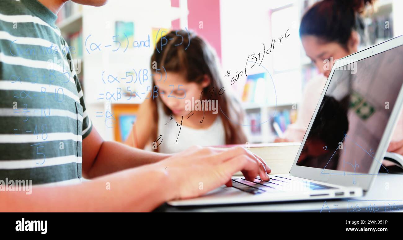 Image of mathematical equations floating over schoolchild using laptop ...