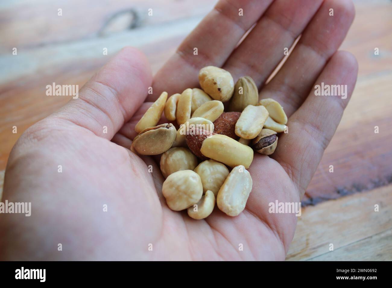 a handful of mixed nuts Stock Photo - Alamy