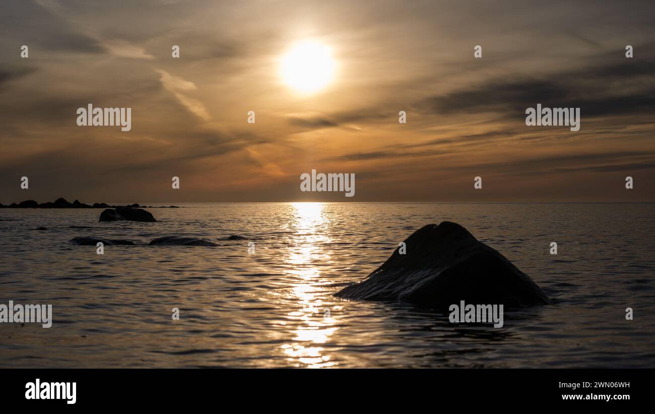 In the embrace of twilight, a lone stone rests peacefully in Veczemju ...