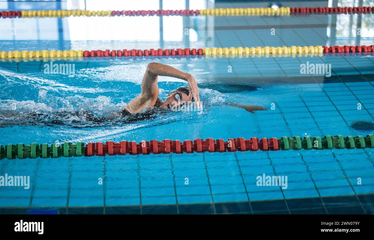 Elite female athlete, professional swimmer during a front crawl ...