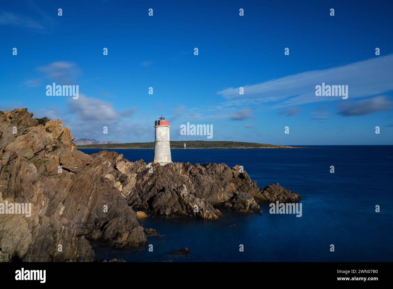A landscape view of the old Capo Ferro Lighthouse in Sardinia Stock ...
