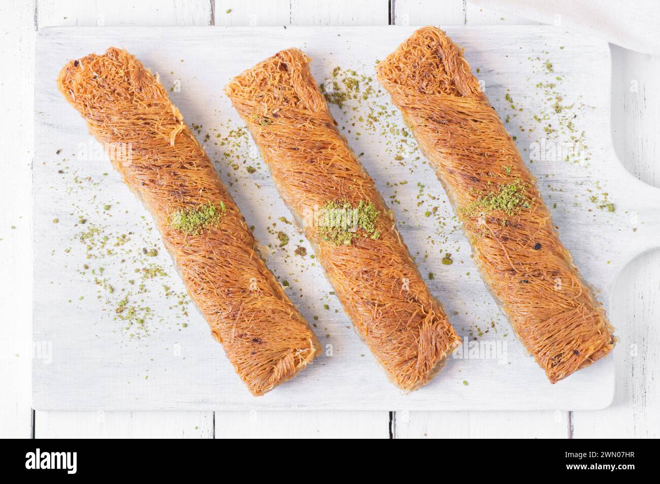 Turkish dessert kadayif, Shredded dough baked in syrup topped with ...