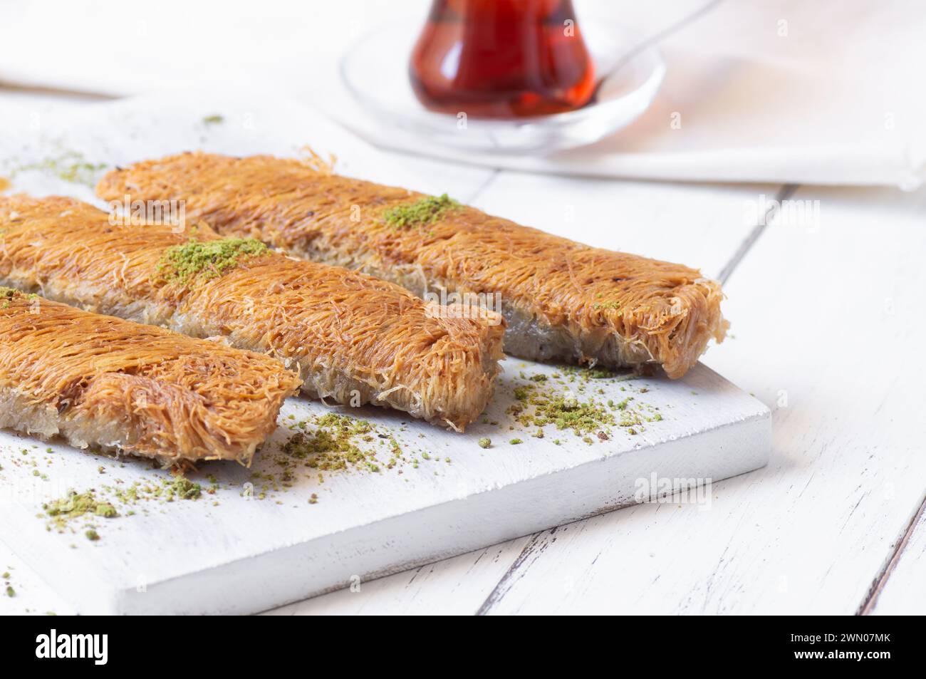 Turkish dessert kadayif, Shredded dough baked in syrup topped with ...