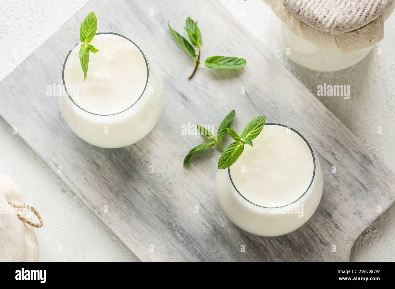 Glass cup of Turkish traditional drink ayran , kefir or buttermilk made ...