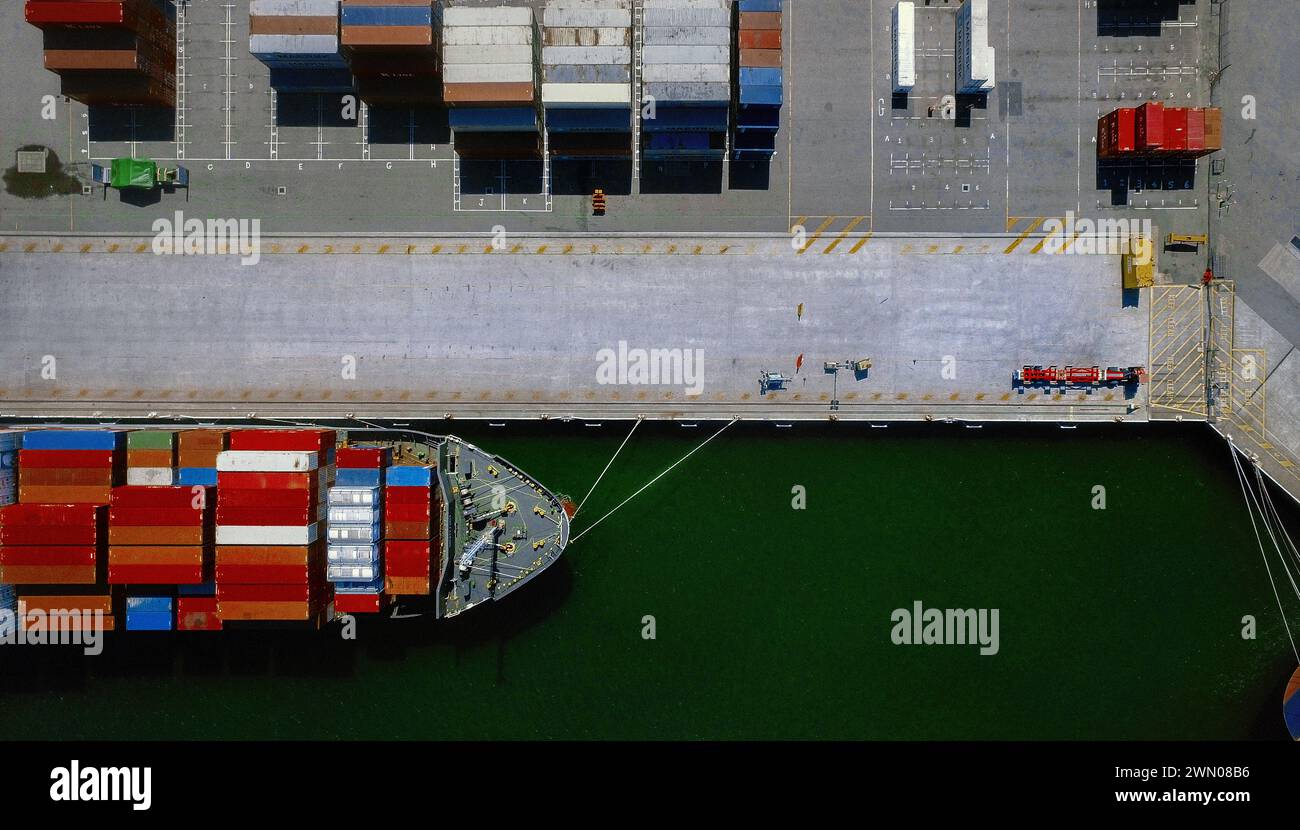 Aerial view of containers loaded on a cargo container ship in dock ...