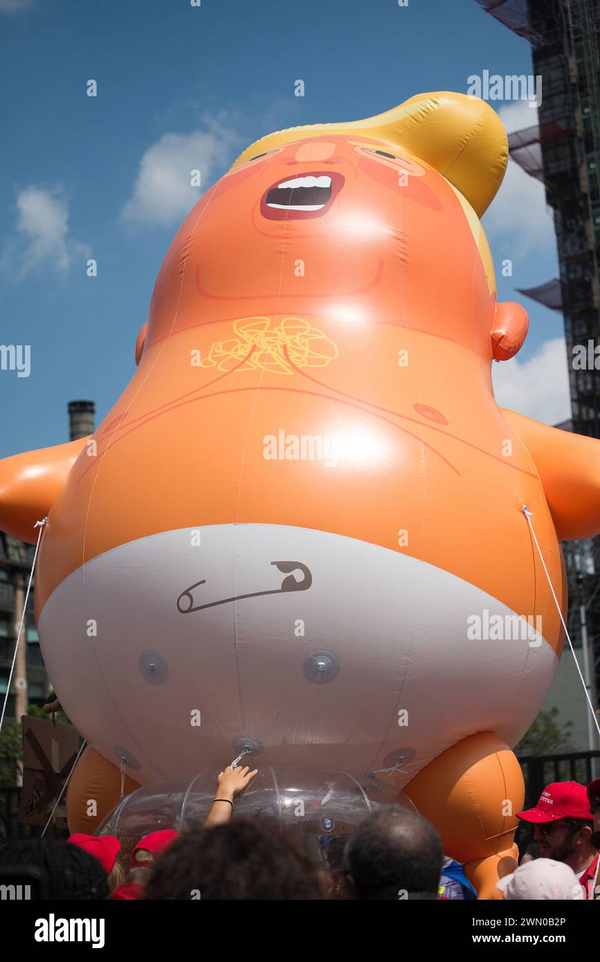 The orange Baby Trump blimp being paraded around Parliament Square ...