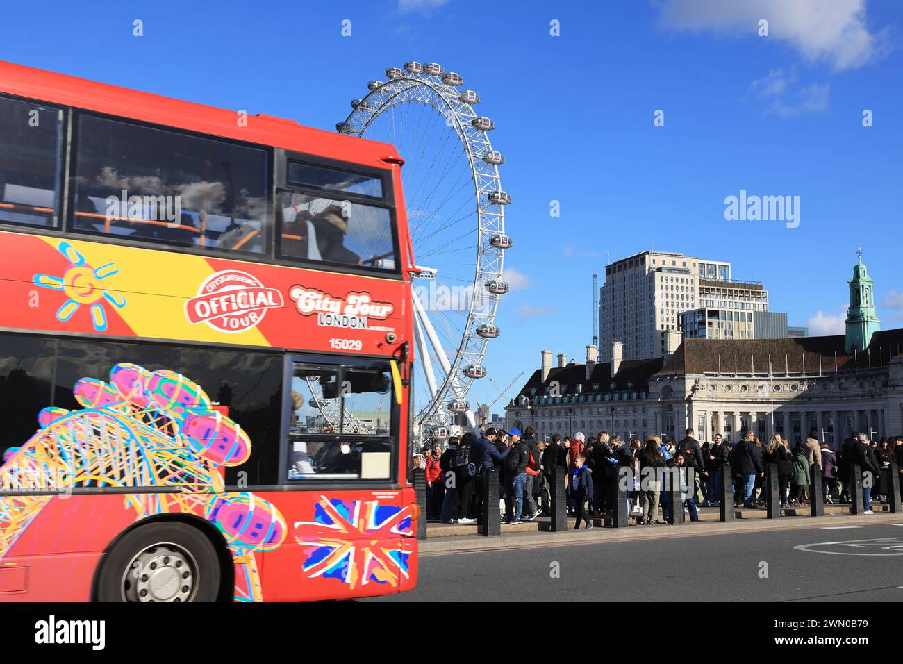 Popular tourist attraction the London Eye, from a busy Westminster ...