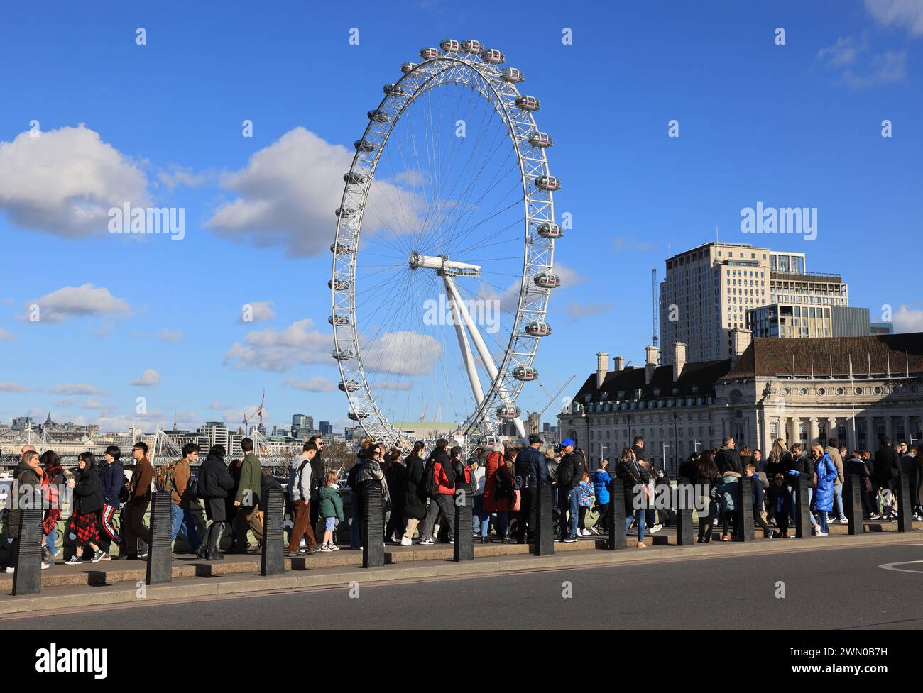 Popular tourist attraction the London Eye, from a busy Westminster ...