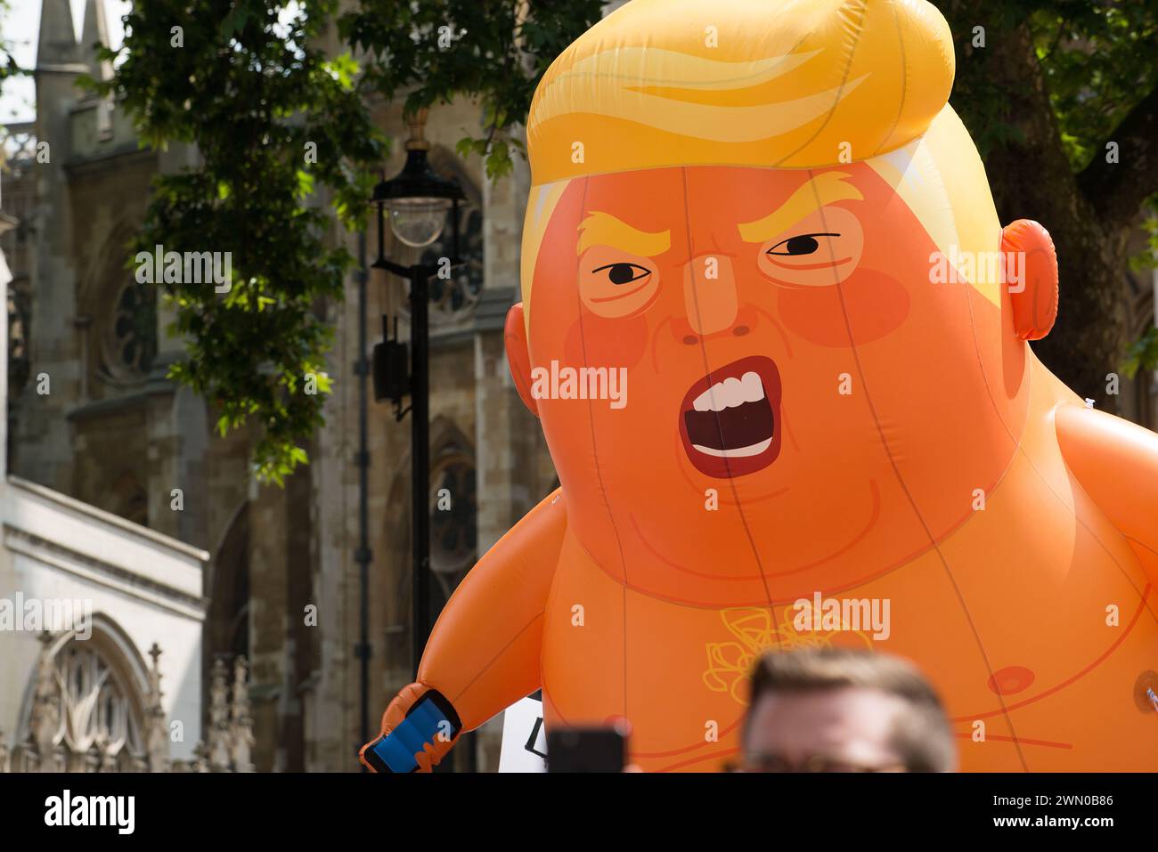 The orange Baby Trump blimp being paraded around Parliament Square ...
