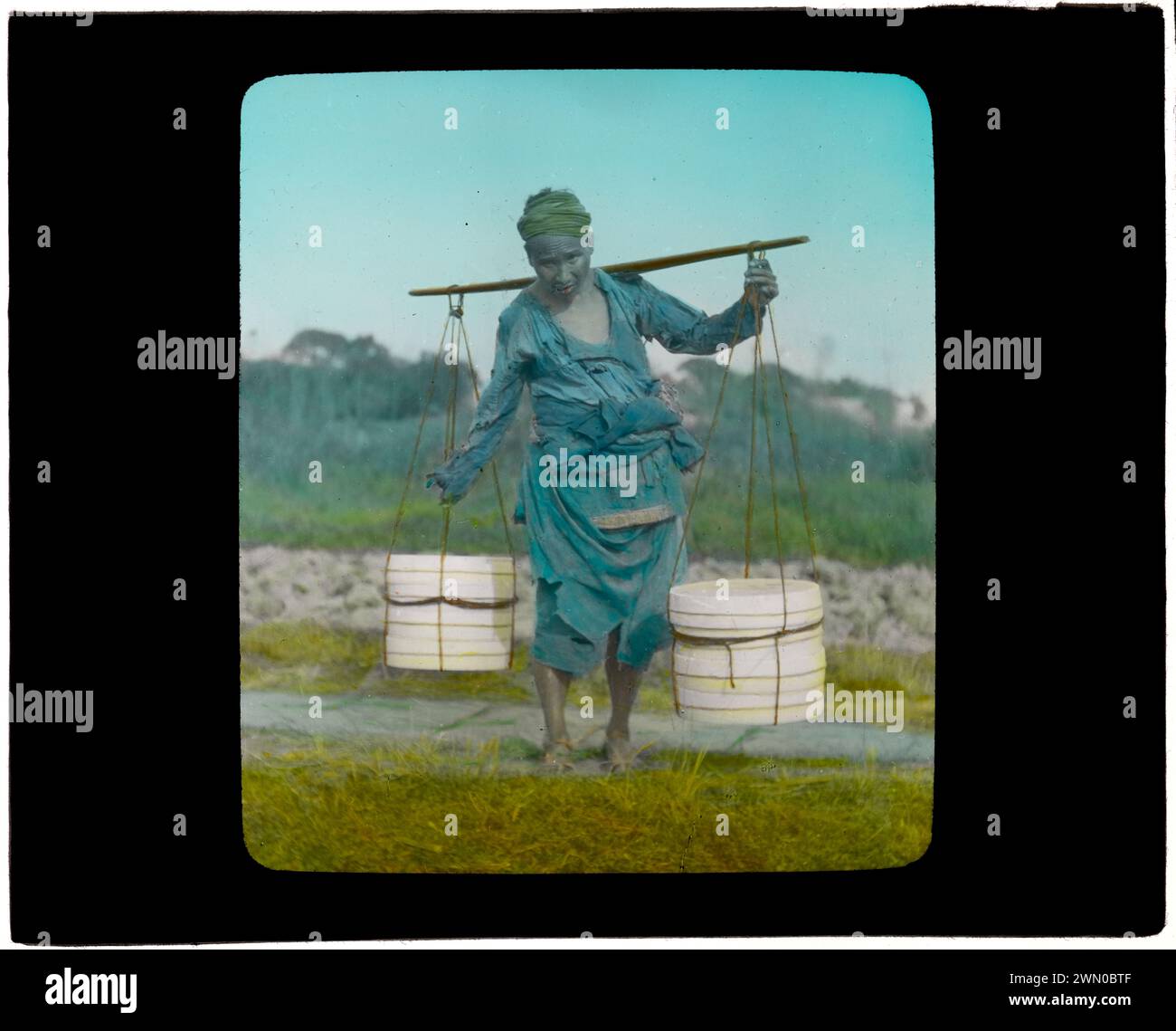 Person carrying water. Person carrying water Stock Photo - Alamy