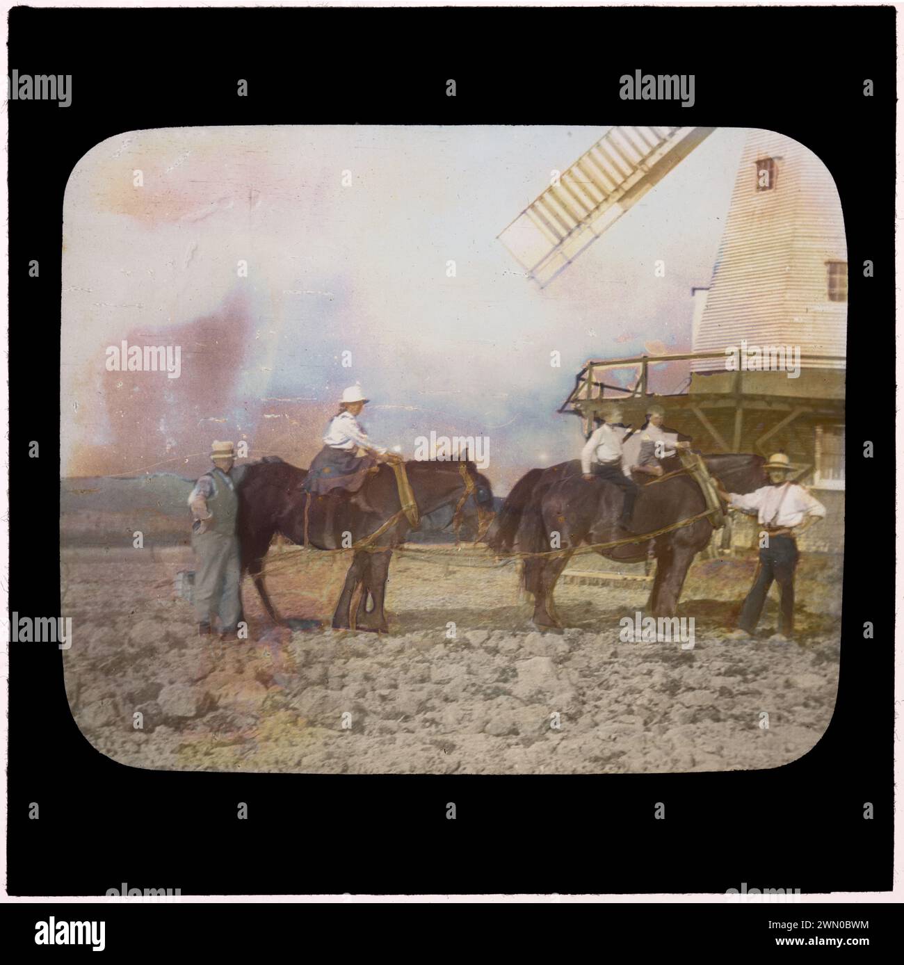 People riding horses that are pulling a plow. People riding horses that ...