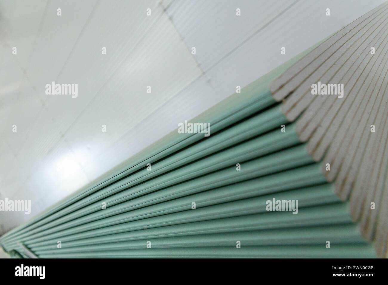 Drywall stacked in stacks at a hardware warehouse. Selective focus with ...
