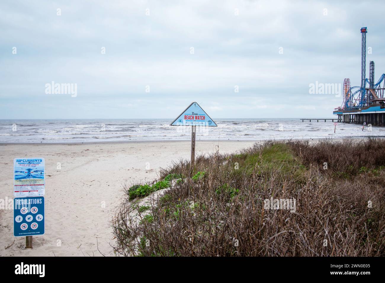 Beach entrance with warning signs. Signs notifying of rules ...