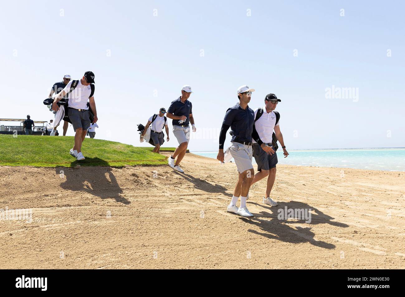 Cameron Tringale and Andy Ogletree of HyFlyers GC with caddies ...