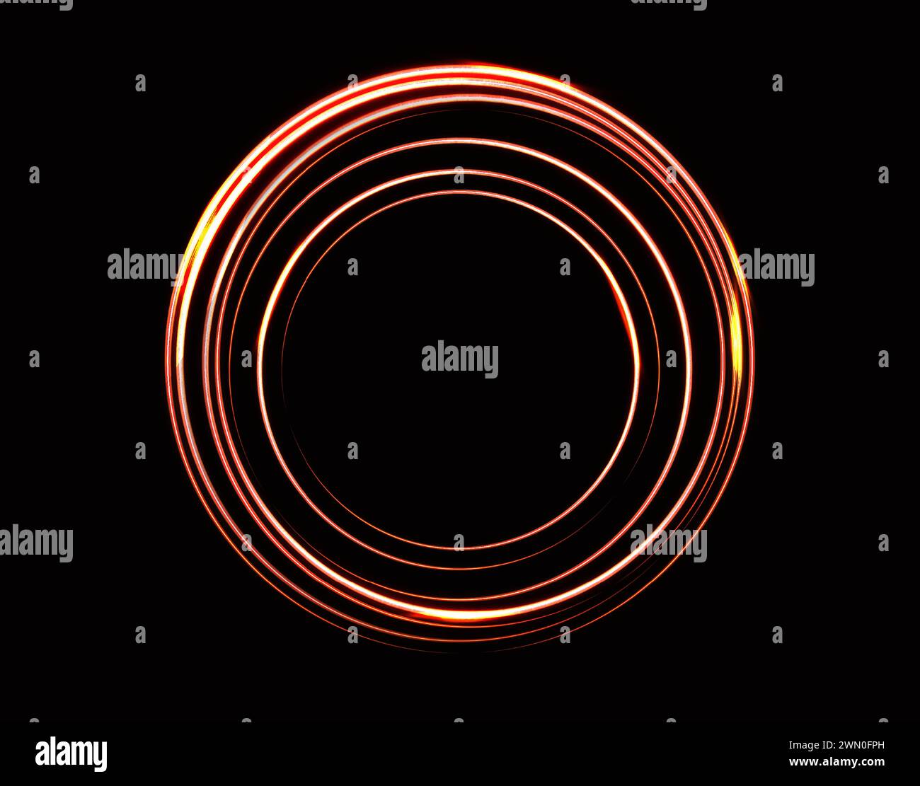Yellow-red laser glowing circle isolated on a black background. Neon ...