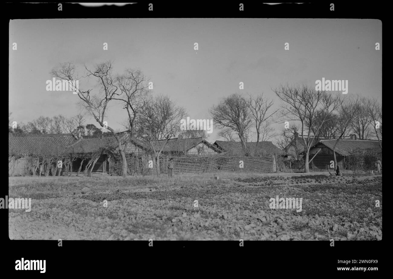 Field with rustic buildings in background. Field with rustic buildings ...