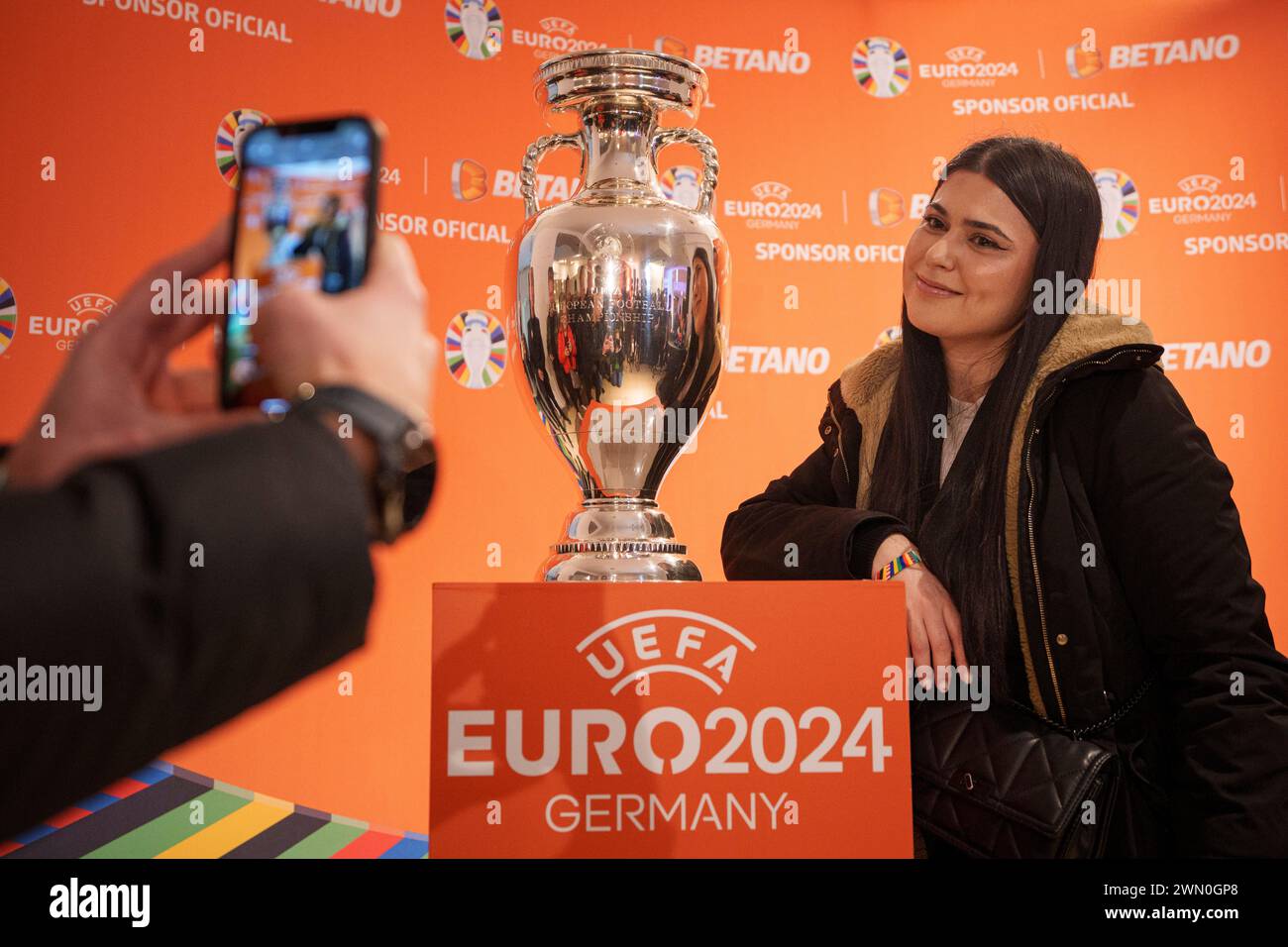 A journalist poses next to the UEFA Euro 2024 soccer tournament trophy ...