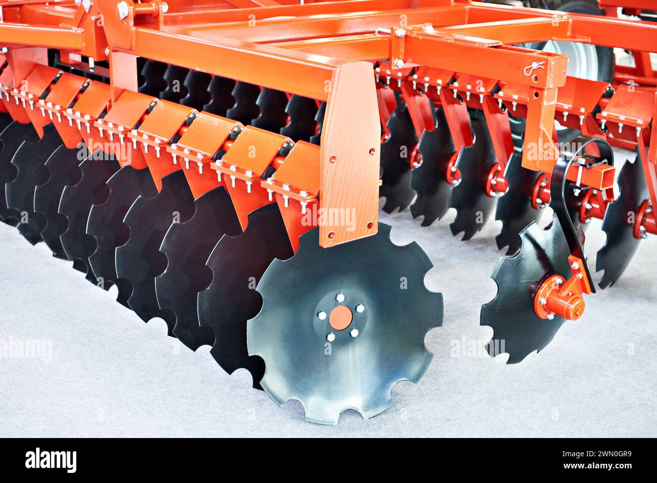 Trailed in-line disc harrow at an agricultural exhibition Stock Photo ...