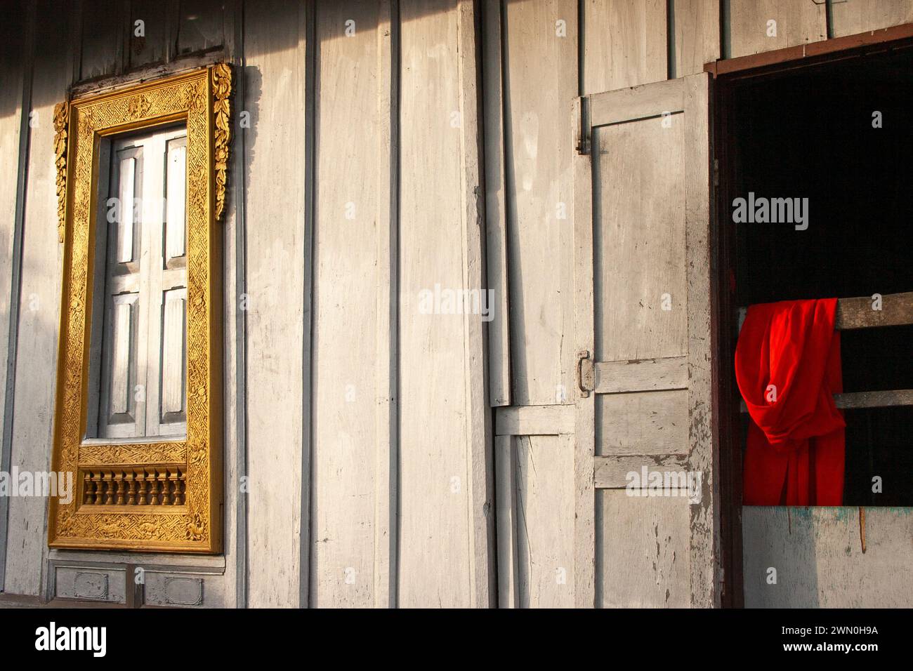 Window frame and living quarters in monastery in Luang Prabang in ...