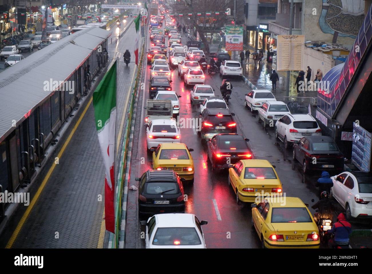 Tehran, Iran. 28th Feb, 2024. Vehicles drive along an avenue ahead of ...
