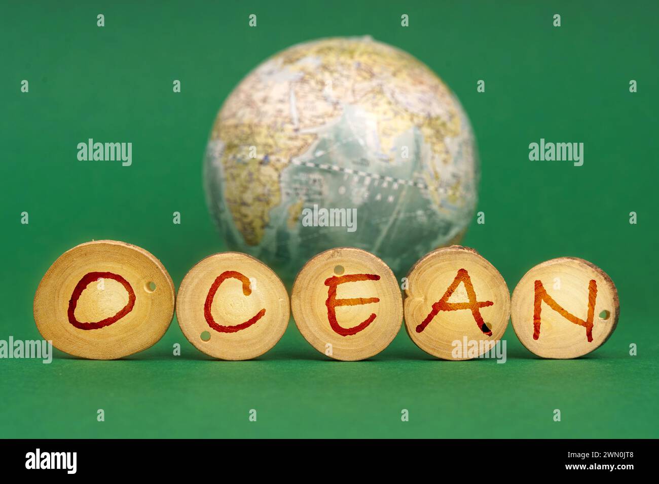 Ecological concept. On a green background there is an Earth globe and ...