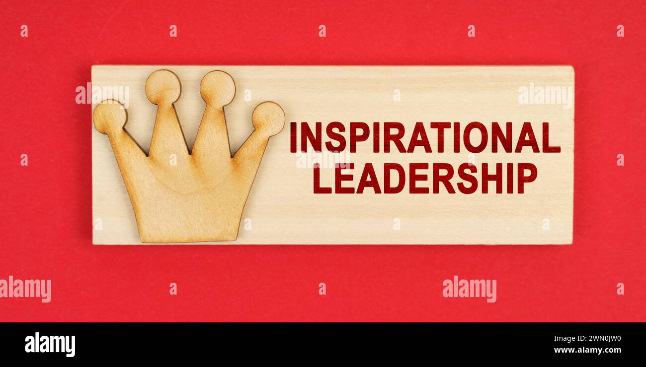 Leader concept. On a red surface there is a wooden block with the ...