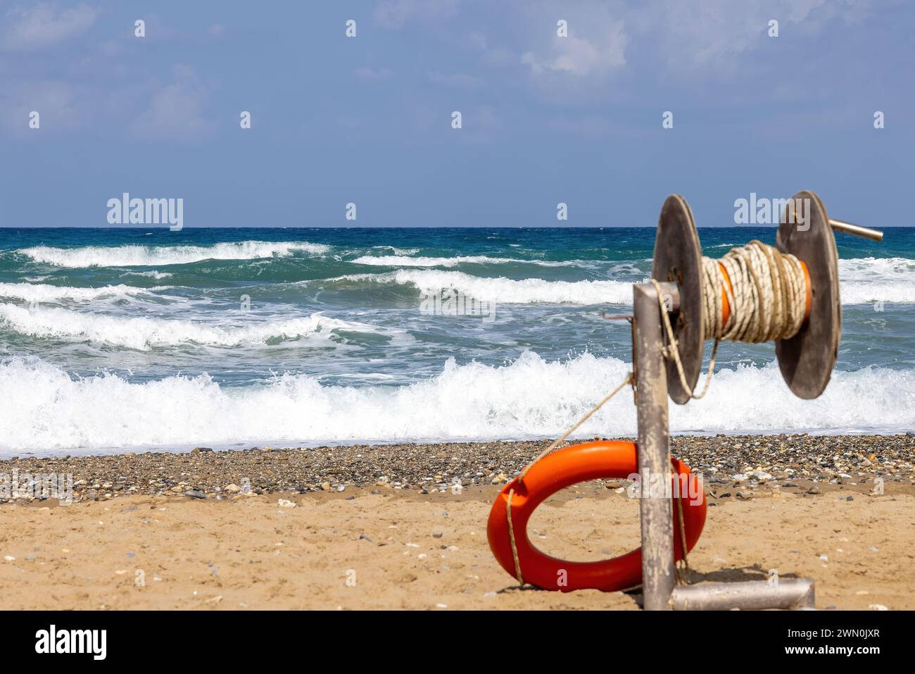 Lifebuoy with throwing device on the beach of Crete, Greece Stock Photo ...