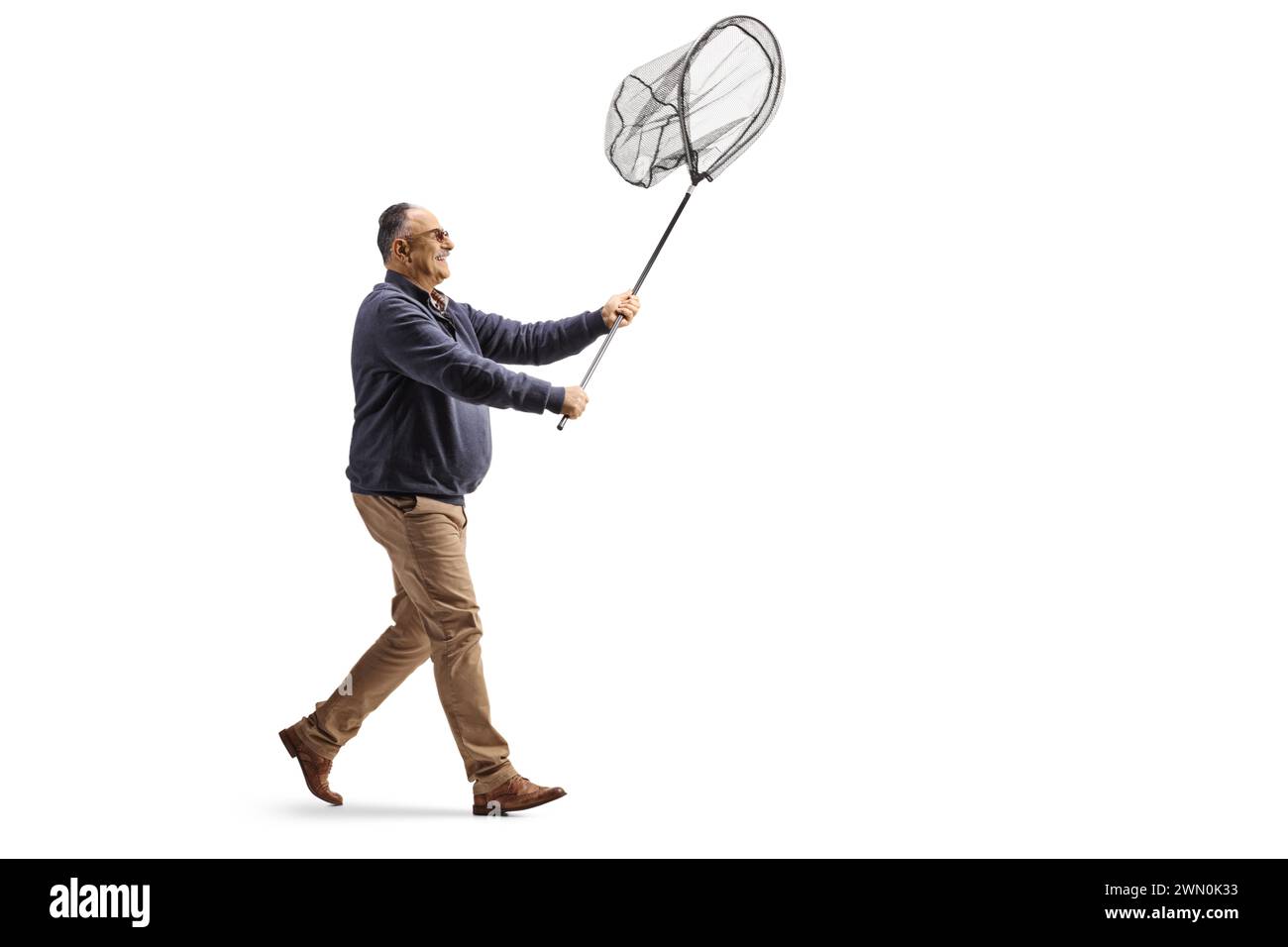 Mature man walking and holding a catching net isolated on white ...