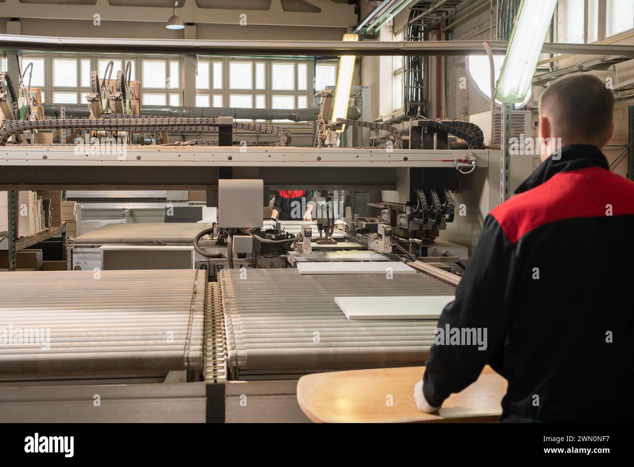 Worker automate machine on industrial hi-res stock photography and ...