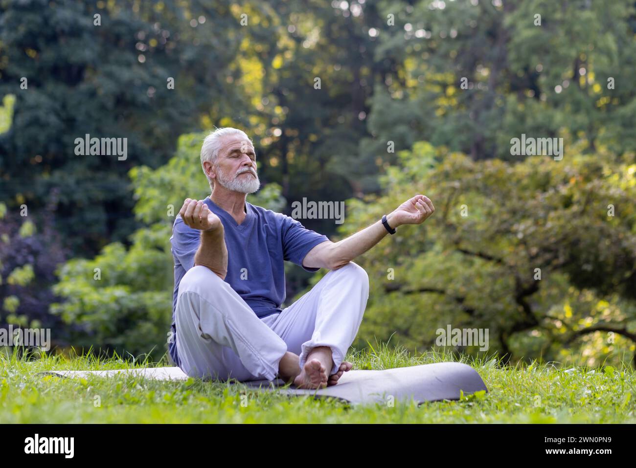 Elderly gentleman meditating in hi-res stock photography and images - Alamy