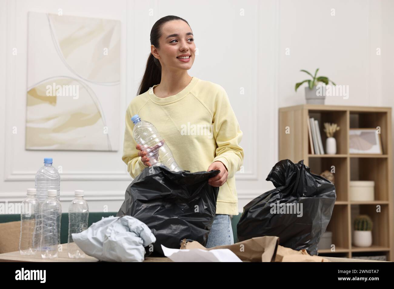 Plastic recycle smiling young hi-res stock photography and images - Alamy