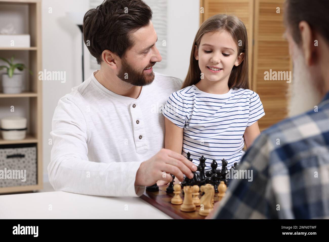 Father daughter playing chess in hi-res stock photography and images ...