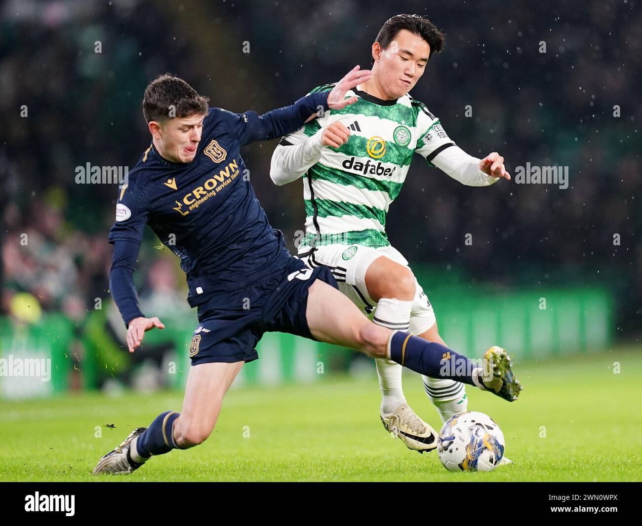 Dundee’s Owen Beck (left) and Celtic’s Yang Hyun-Jun battle for the ...