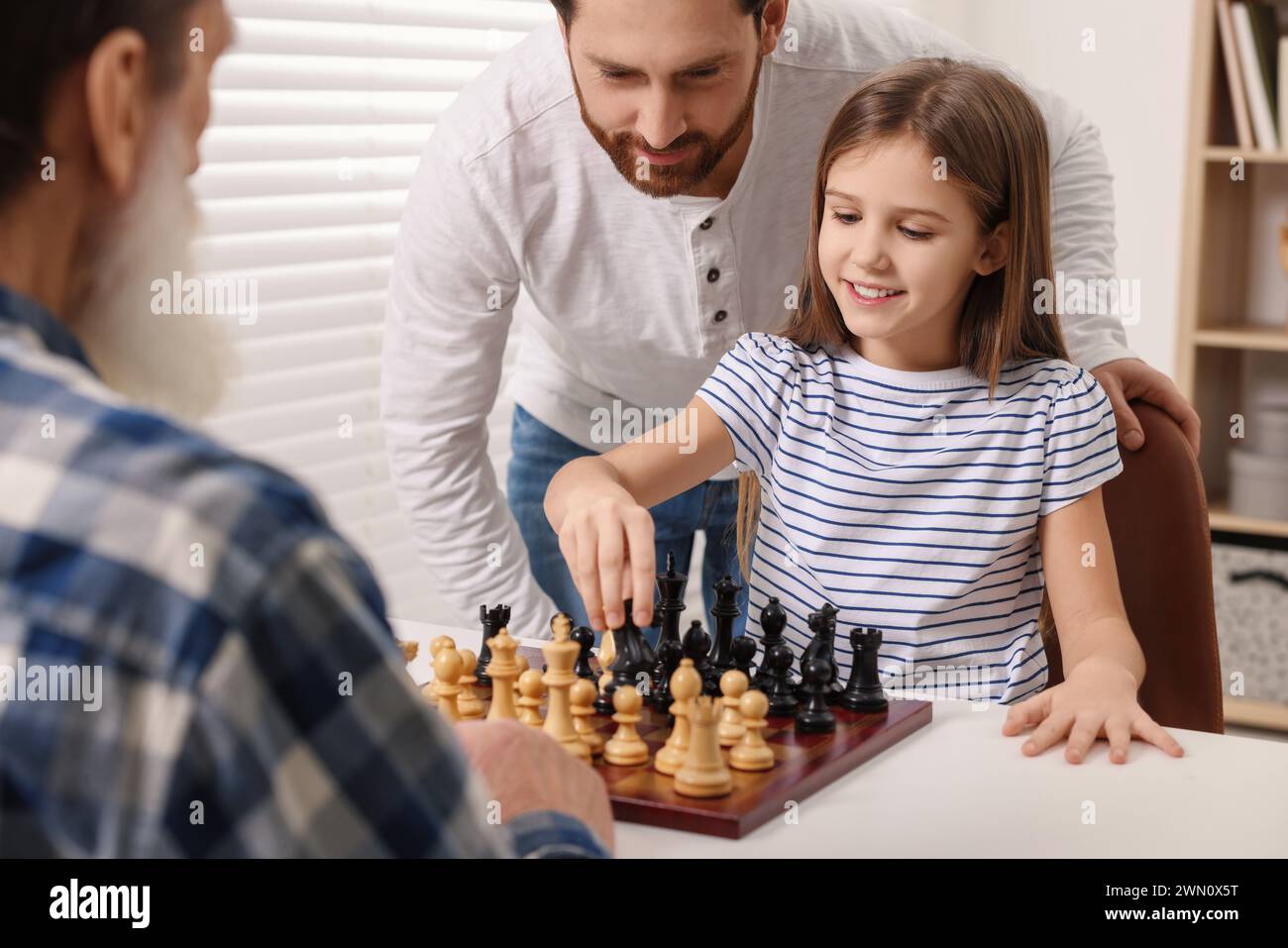 Father daughter playing chess in hi-res stock photography and images ...
