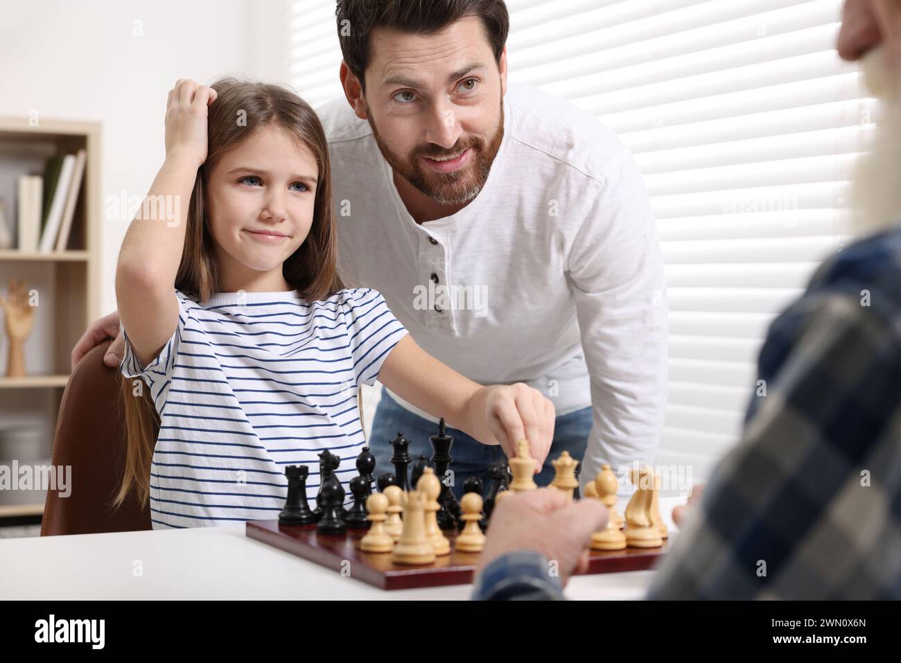 Father daughter playing chess in hi-res stock photography and images ...