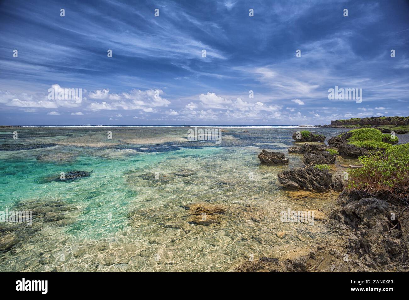 The shallow tide pools near Inarajan, Guam with it's jagged lava ...