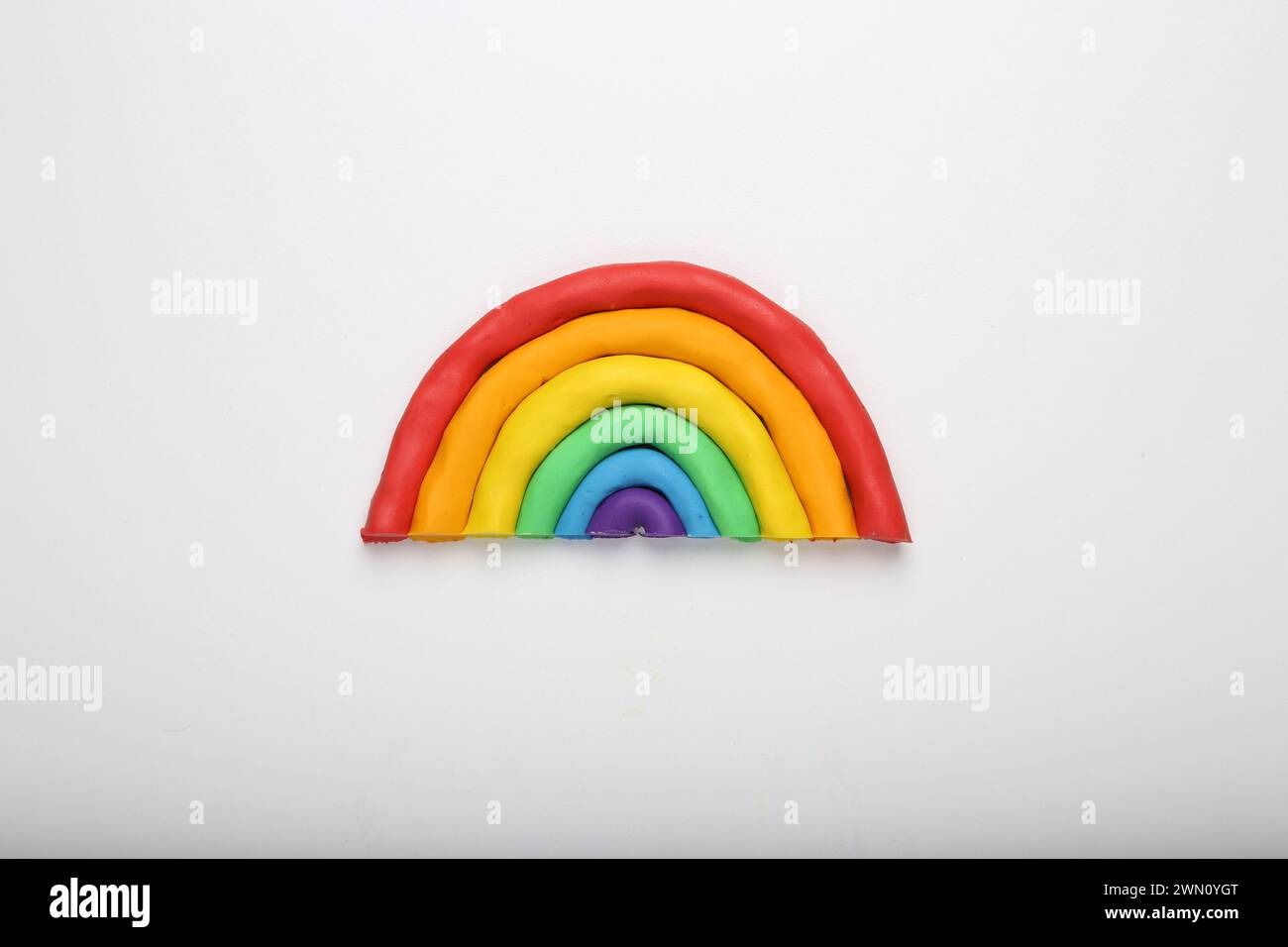 Beautiful rainbow made of plasticine on white background, top view ...