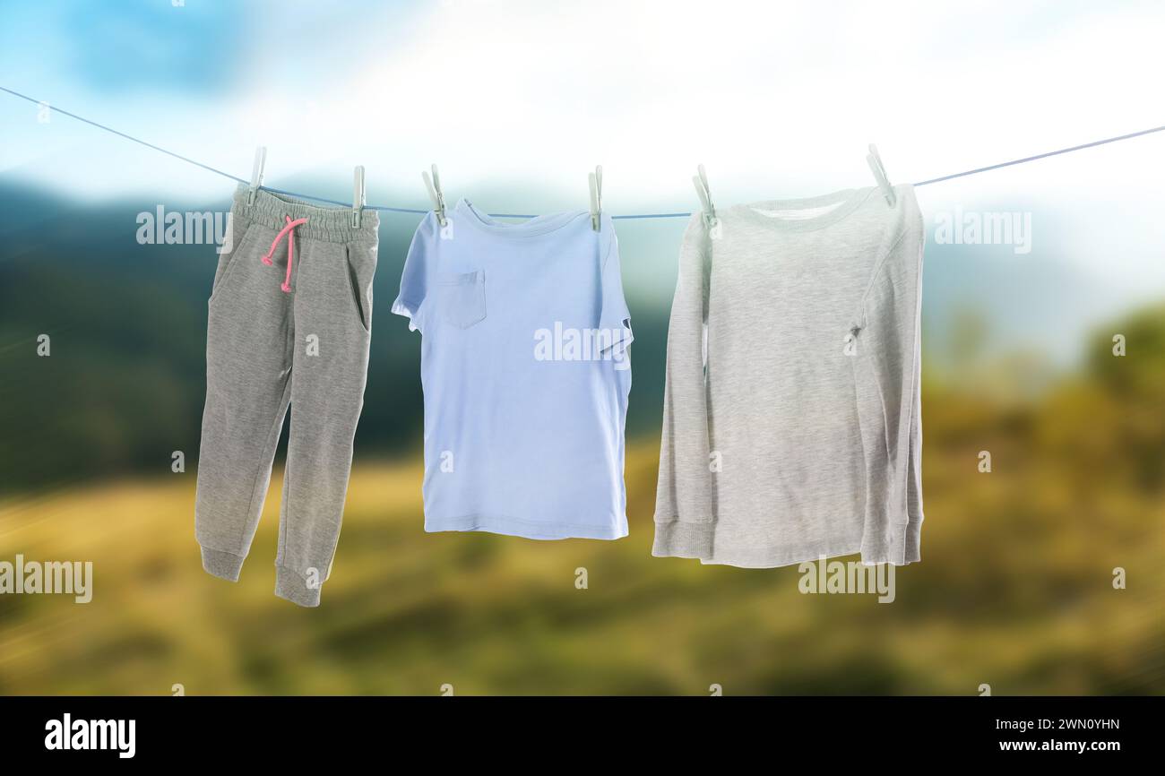 Different clothes drying on washing line outdoors, banner design Stock ...