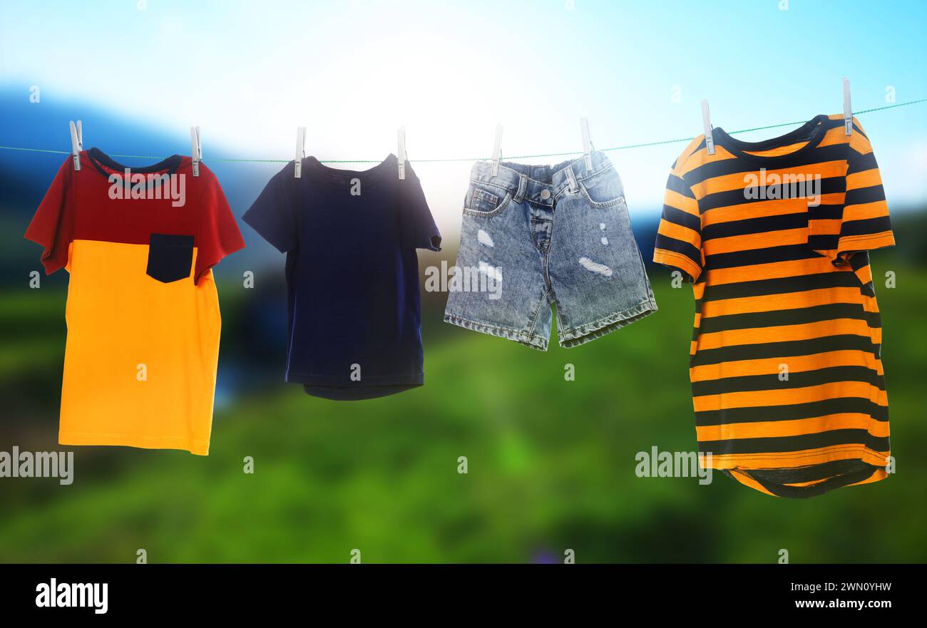 Different clothes drying on washing line outdoors, banner design Stock ...