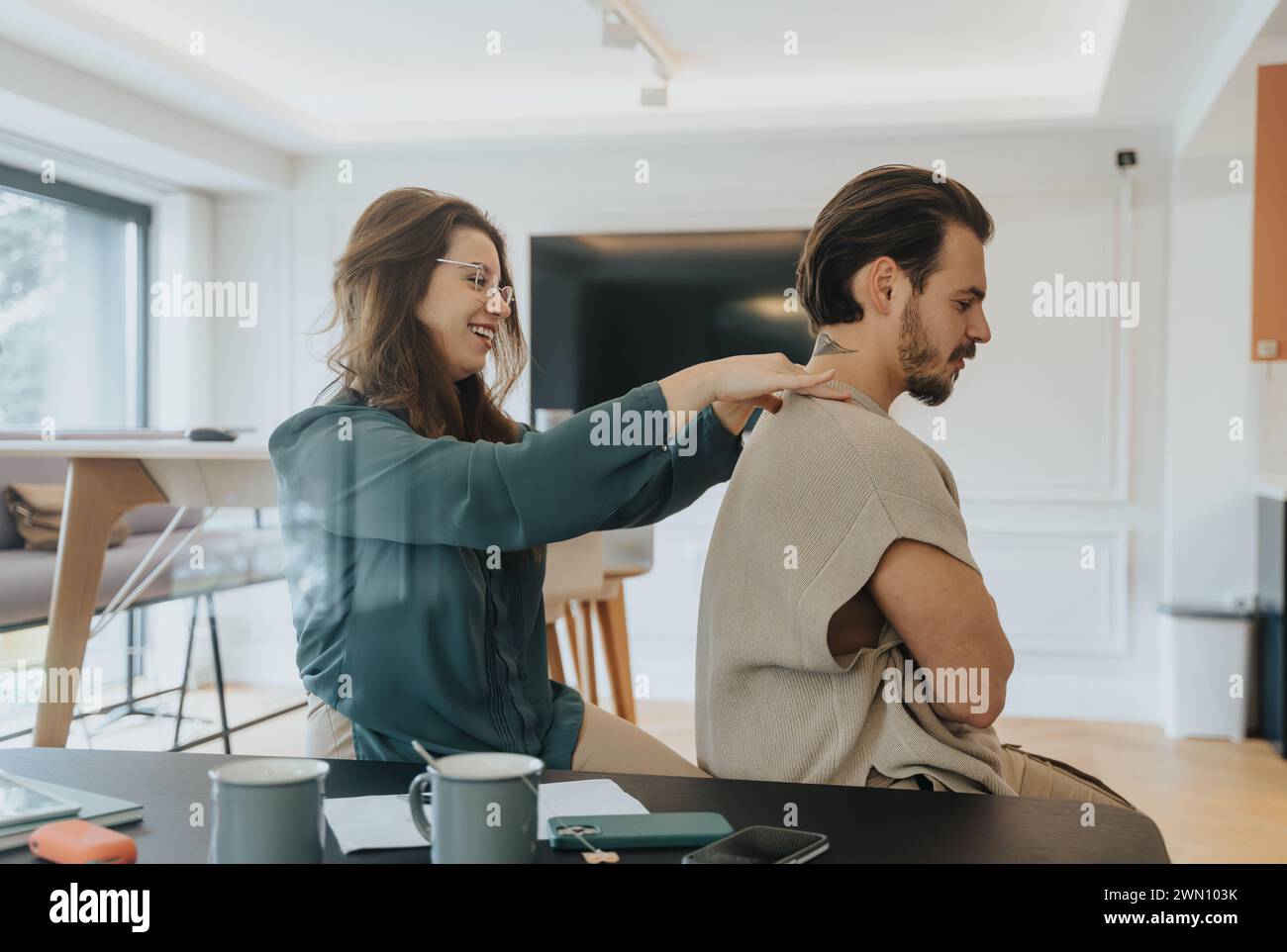 A caring woman treats her partner to a calming massage, creating a ...