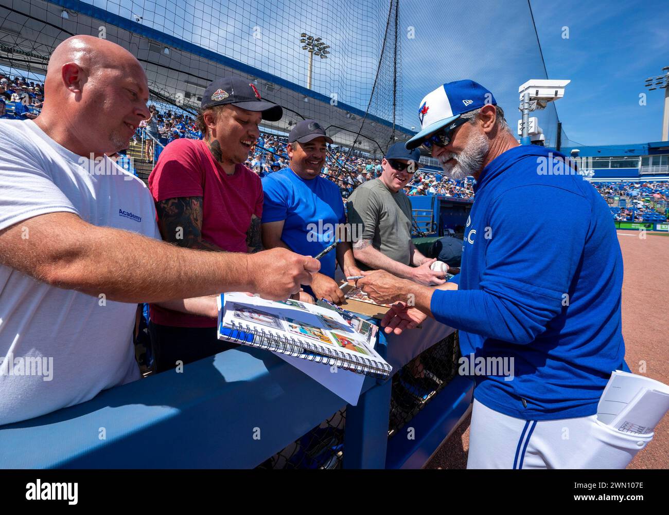 Toronto Blue Jays bench coach Don Mattingly signs autographs prior to ...