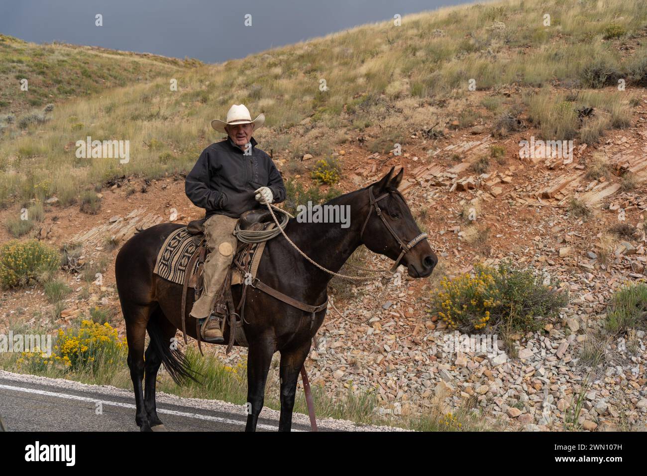 Caribou County Idaho – September 13, 2013: Cowboy riding a horse gives ...