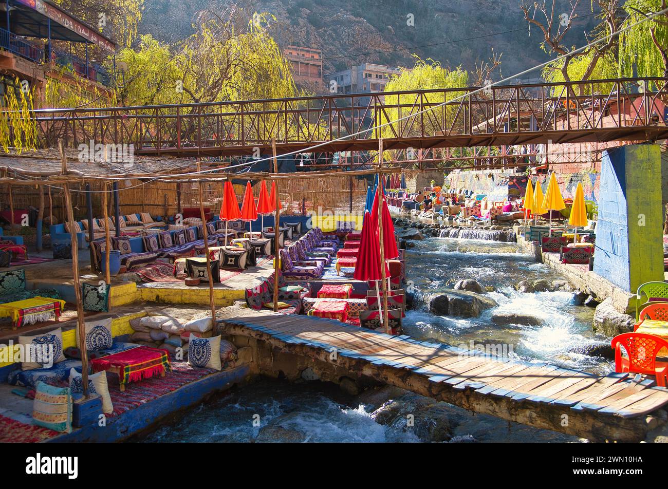 Colourful outdoor restaurants with tables in or overlooking the river ...
