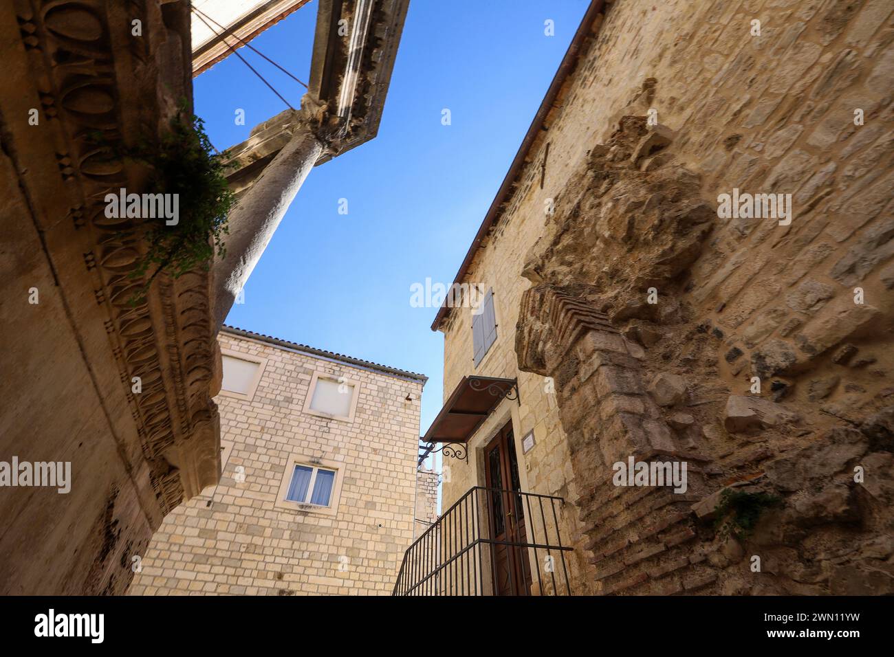street view of the upper floors of stone medieval residential buildings ...