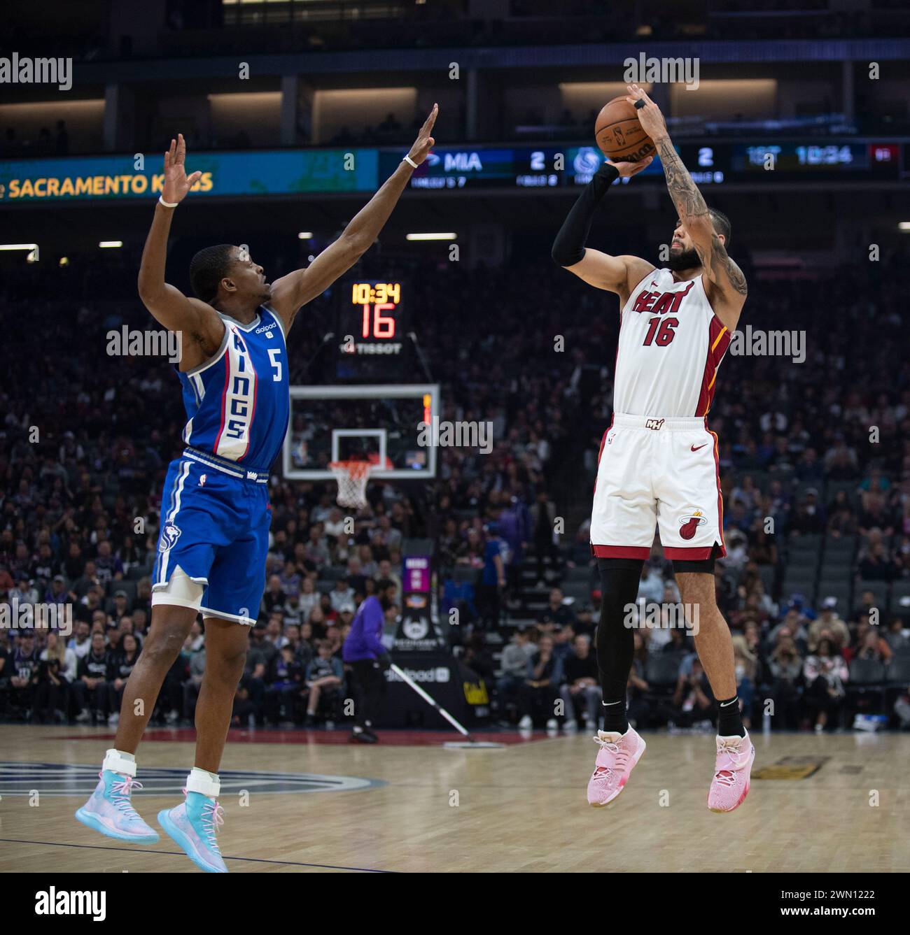 Miami Heat forward Caleb Martin (16) shoots over Sacramento Kings guard ...