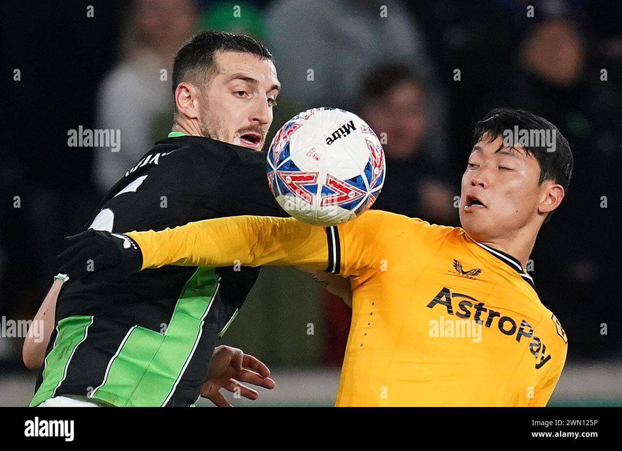 Brighton and Hove Albion's Lewis Dunk (left) and Wolverhampton ...
