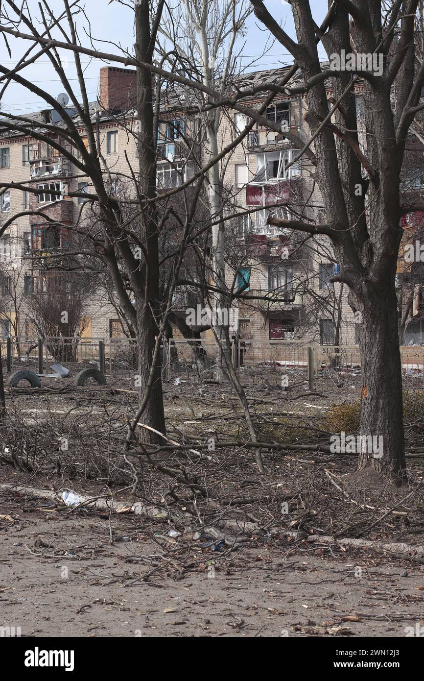 No windows, damaged roof, mutilated trees after a rocket attack Stock ...